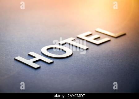 Word hotel written with white solid letters on a board. Word hotel ...