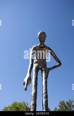 Metal Statue in Elora Ontario man standing blue sky Stock Photo - Alamy