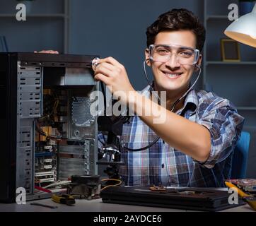 Computer repair concept with man inspecting with stethoscope Stock ...