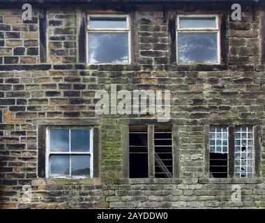 old stone ruined window with moss and plants growing around Stock Photo ...
