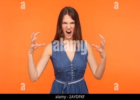 Brunette hispanic girl crazy and mad shouting and yelling with ...