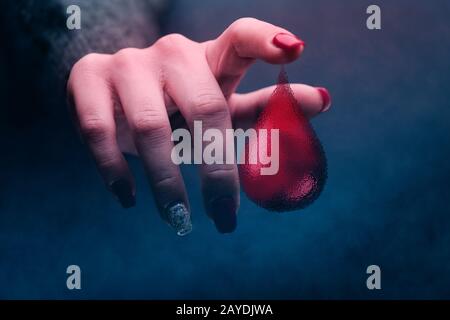 Woman hand blood drop. World Blood Donor Day. Mixed media Stock Photo ...
