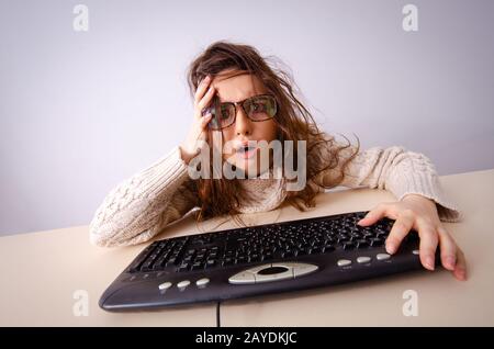 The funny nerd girl working on computer Stock Photo - Alamy