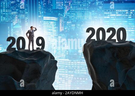 Businessman looking into the future 2020 from 2019 Stock Photo - Alamy