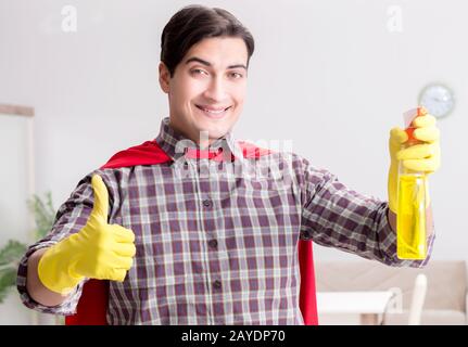 The super hero cleaner doing housework Stock Photo - Alamy