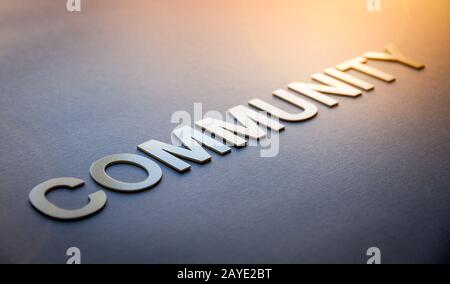 Word community written with white solid letters on a board Stock Photo ...