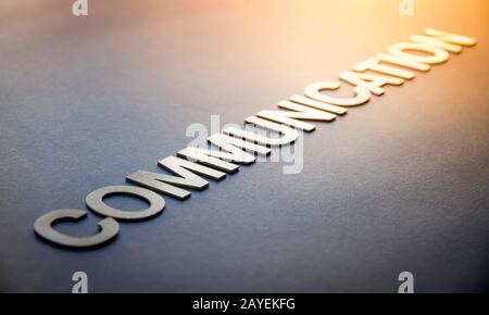 Word communication written with white solid letters on a board Stock ...