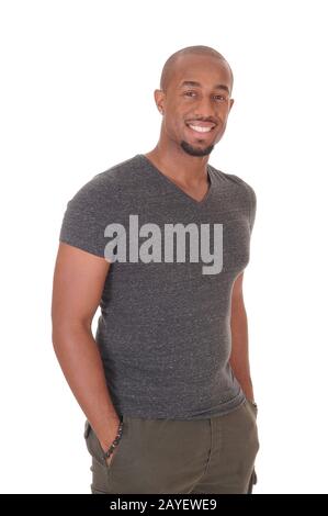 Man standing waist-up in a sunlit green park, eyes closed and hands on ...