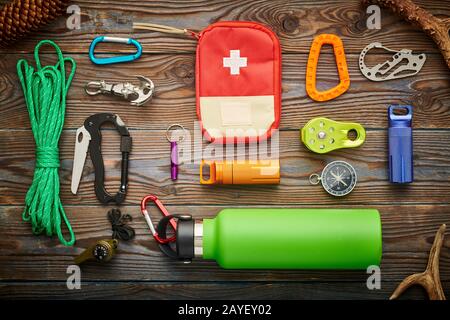 Travel items for hiking over wooden background Stock Photo - Alamy