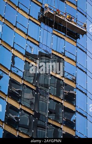 Construction workers fall from a height but have safety to help ...