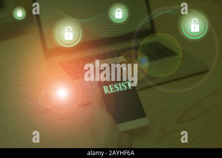 Conceptual hand writing showing Resist. Concept meaning To fight ...