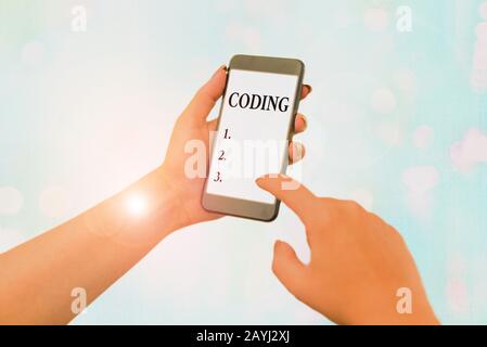 Conceptual hand writing showing Coding And Programming. Business photo showcasing Design and ...