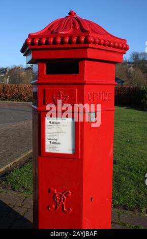 Red hexagonal Victorian Royal Mail pillar box on Abbey Bridge End (road ...