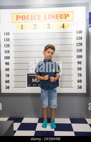 Little boy in prison in playroom Stock Photo - Alamy