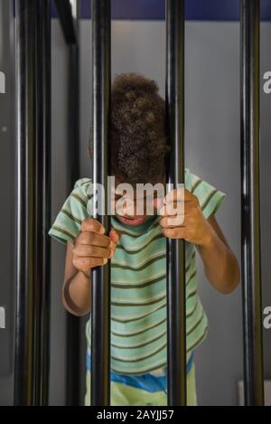 Little boy in prison in playroom Stock Photo - Alamy