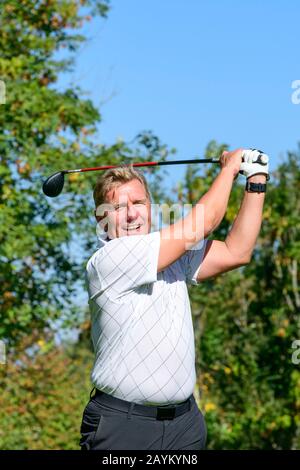 Man having fun while playing golf Stock Photo - Alamy