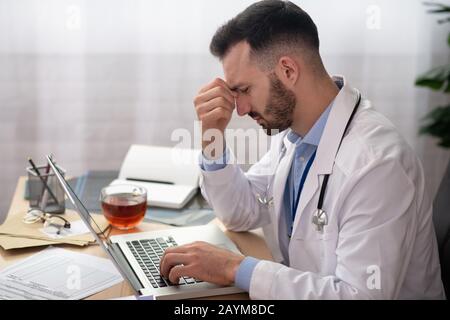 Young handsome doctor working night shift in hospital Stock Photo - Alamy