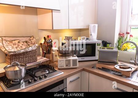 Small modern kitchen in tiny studio apartment Stock Photo - Alamy