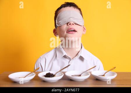 Blind Taste. Blindfolded Food Test. Man Face Stock Photo - Alamy