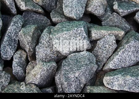 The picture shows a background with many grey stones Stock Photo - Alamy