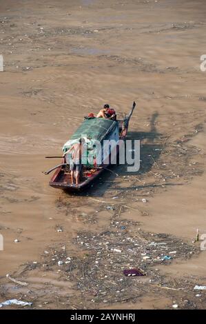 Asian people collecting garbage on beach Stock Photo - Alamy