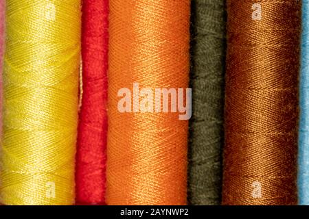 Vertical cones with colored sewing thread Stock Photo - Alamy