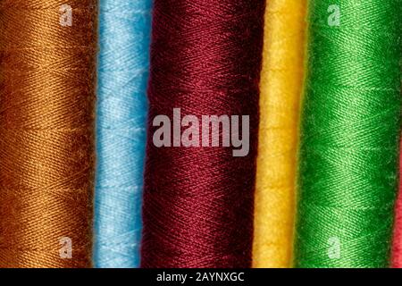 Vertical cones with colored sewing thread Stock Photo - Alamy