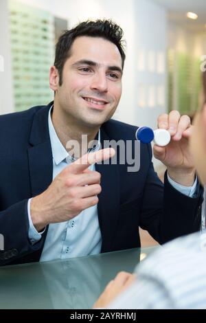 cropped view of optometrist pointing at eye chart Stock Photo - Alamy