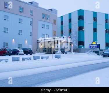Northwest Territories, territory of Canada, flag on dry earth ground ...