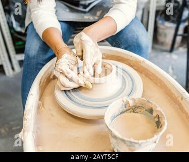 girl works with potter wheel Stock Photo - Alamy
