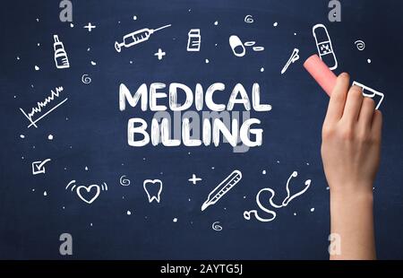 Hand drawing MEDICAL BILLING inscription with white chalk on blackboard ...
