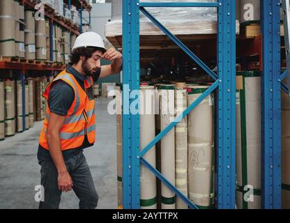 Stressed factory worker Stock Photo - Alamy