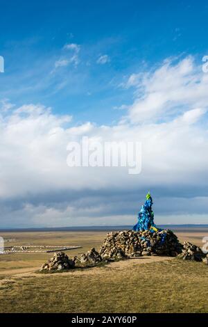 Mongolian sacred cairn or ovoo & prayer flags to worship mountains, sky ...