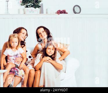 young pretty brunette mother with little cute boy walking in park happy ...