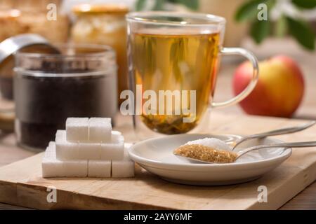 Pyramid made of cane sugar cubes isolated on white Stock Photo - Alamy