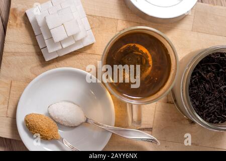 Pyramid made of cane sugar cubes isolated on white Stock Photo - Alamy