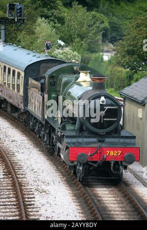 7827 Lydham Manor hauls a train past Goodrington Sands, Paignton Stock ...