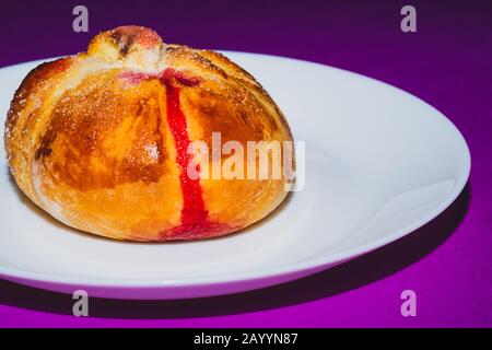 Bun with red sweet jam inside. sweet baking close up Stock Photo - Alamy