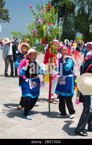China: Bai women dancing at the Bai music and dance festival at San Ta ...