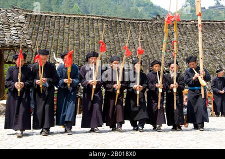 China: Miao men playing the lusheng, a traditonal Miao instrument, in ...