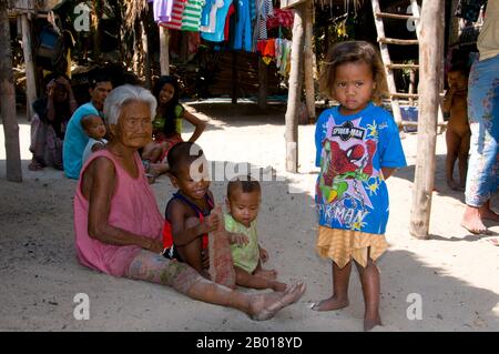 Moken sea gypsy family in a small island village off the coast of Stock ...