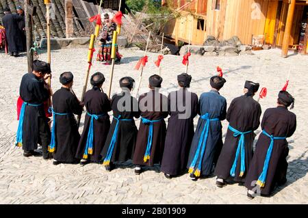 China: Miao men playing the lusheng, a traditonal Miao instrument, in ...
