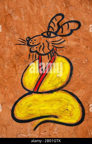 China: Dongba (Naxi) pictographic script adorns a house in the Old Town ...