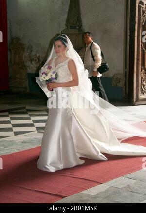 Philippines: A bride enters San Agustin (St. Augustine) Church ...