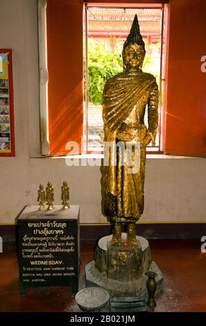 Standing golden Buddha in Viharn of Wat Suan Duak is a Buddhist temple ...