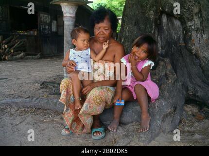 Moken sea gypsy family in a small island village off the coast of south ...