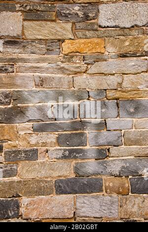 Surface with asymmetrical stones. Wall pattern texture background. Old ...