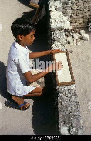 Boy writing in sand with stick, Grand Sand Dunes National Park ...