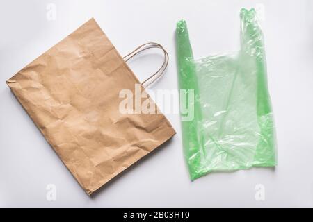 the paper cotton eco versus plastic package flat lay. environmental ...