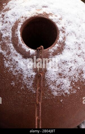 Old rusty metal ships buoy and chain with snow Stock Photo - Alamy